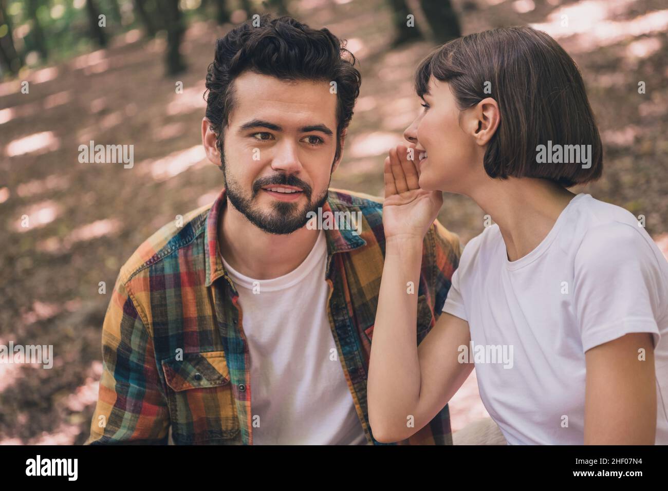 Photo portrait young couple spending time together in forest wearing ...