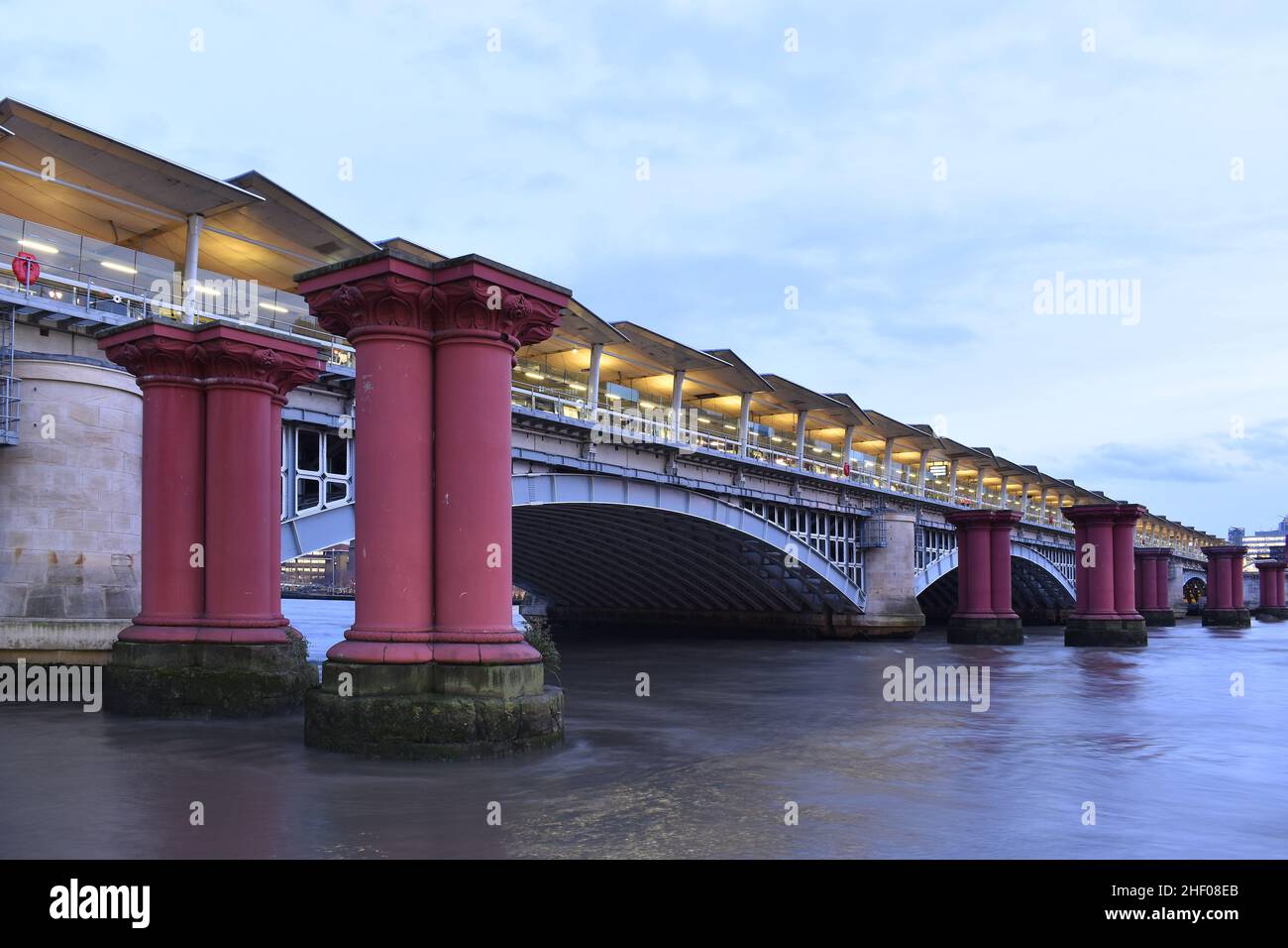 Blackfriars Railway Bridge and remains of the old bridge at dusk in ...