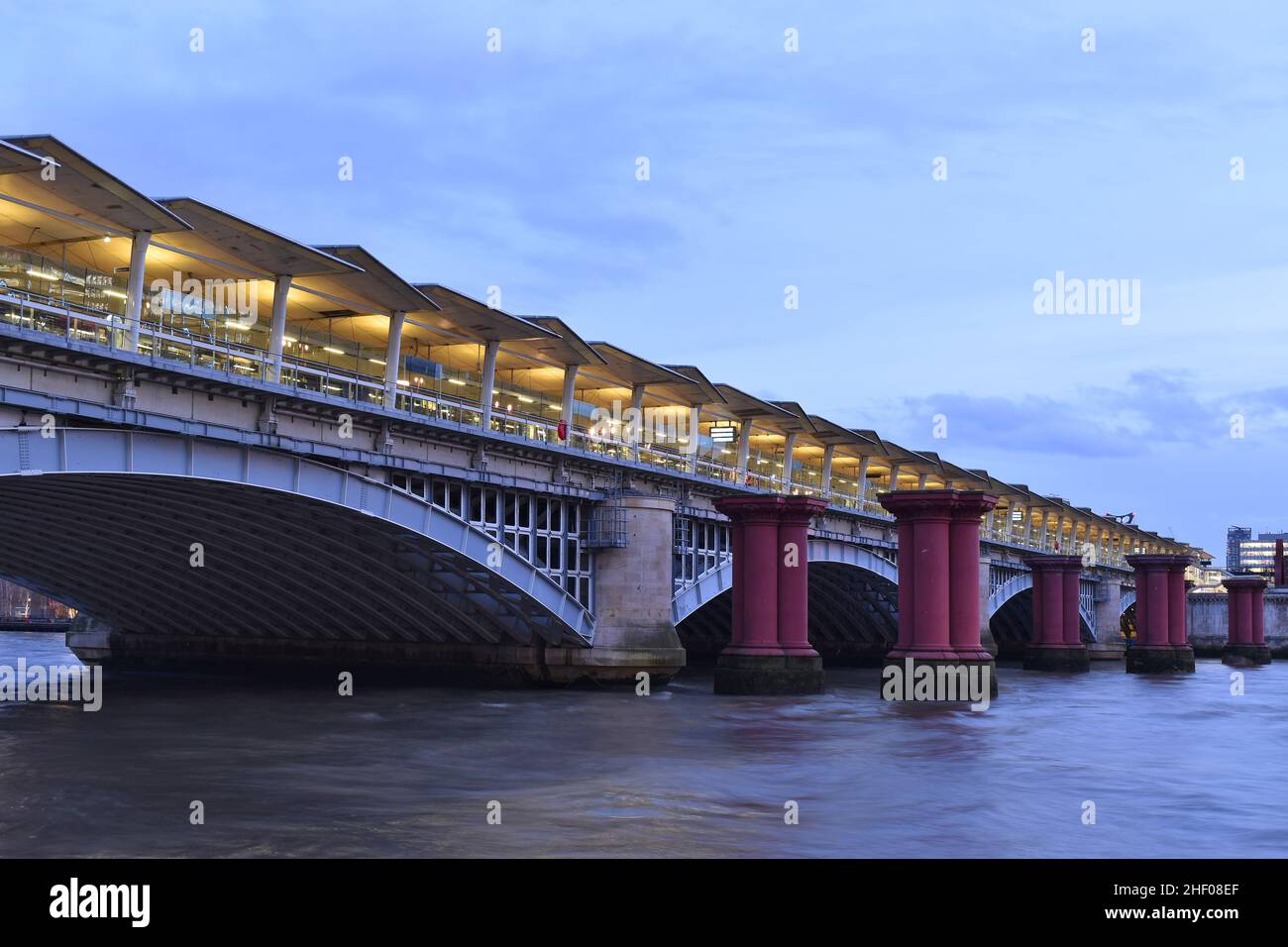 Blackfriars Railway Bridge and remains of the old bridge at dusk in ...