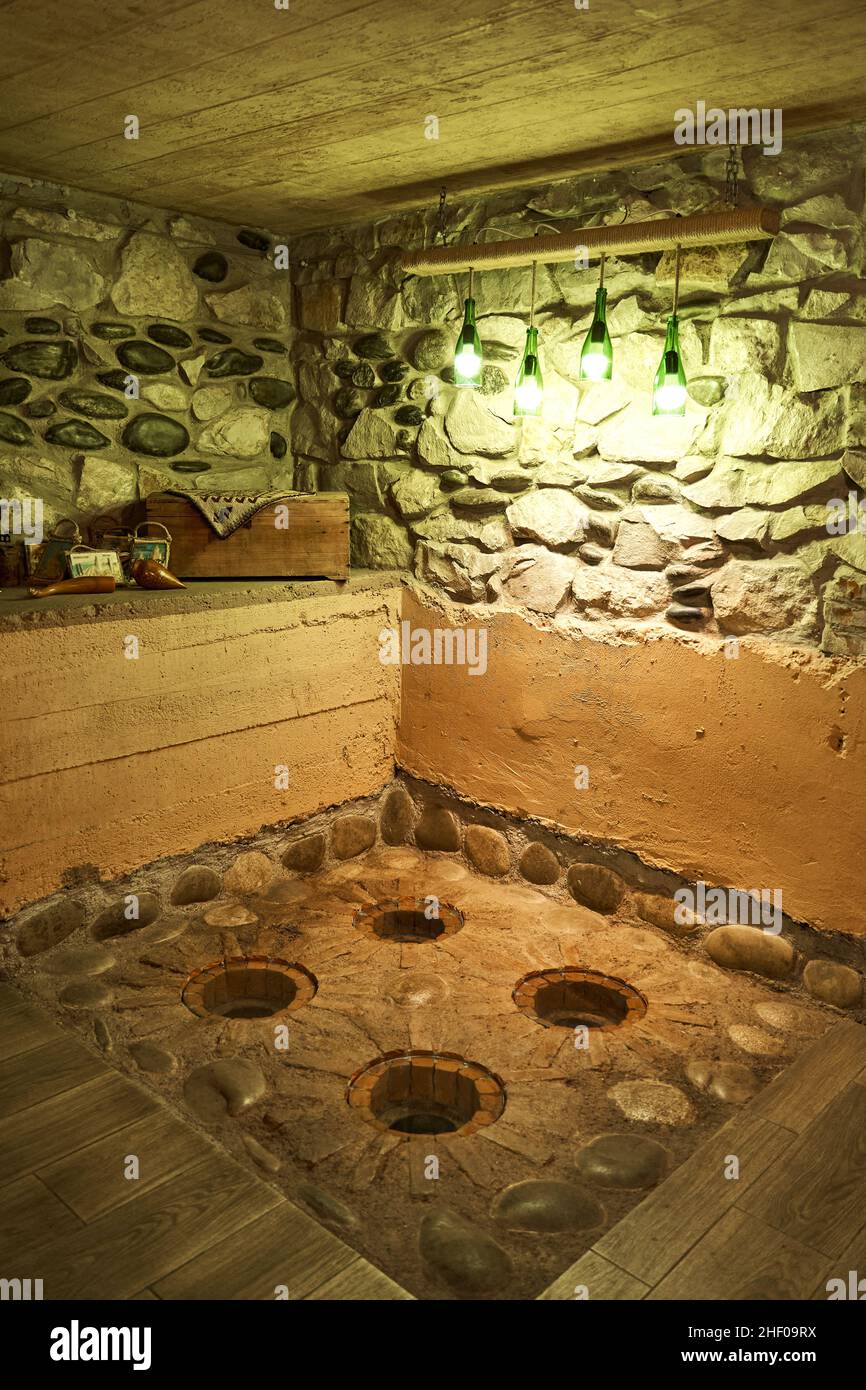 Georgian wine cellar. The wine containers are dug into the ground Stock ...