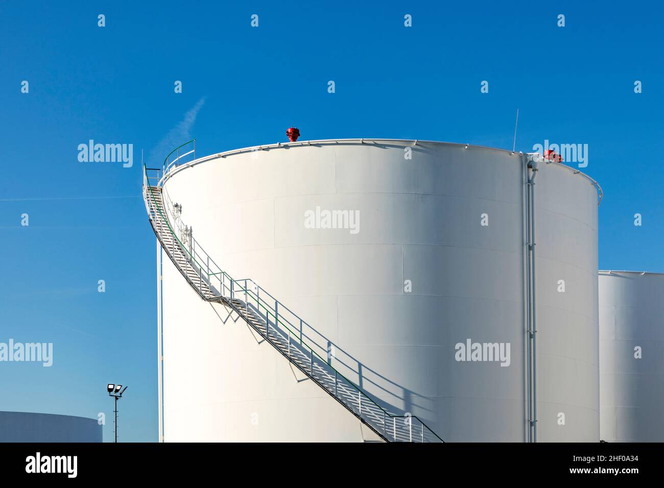huge white silos in a silo farm with petrol Stock Photo - Alamy