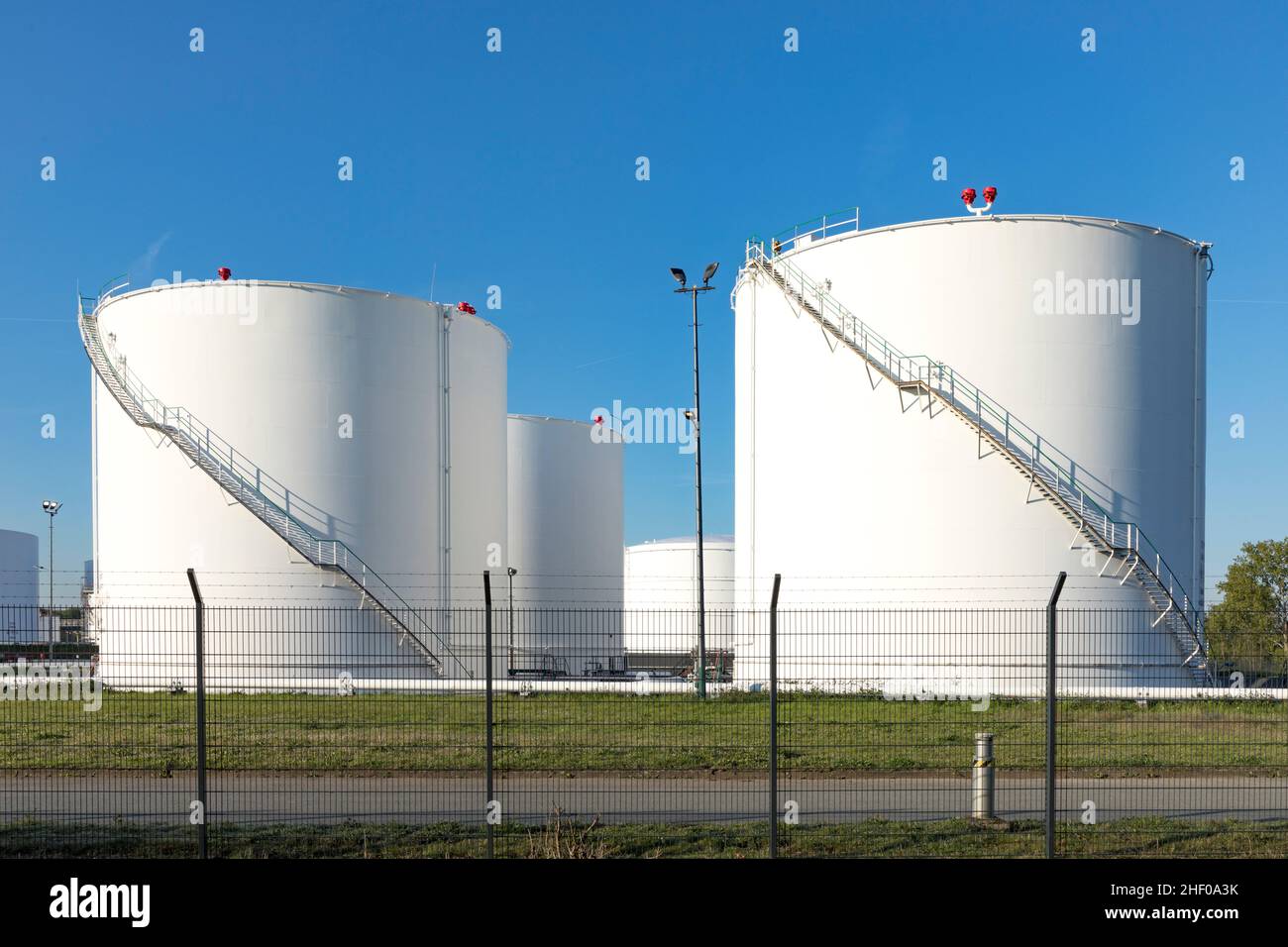 huge white silos in a silo farm with petrol Stock Photo - Alamy