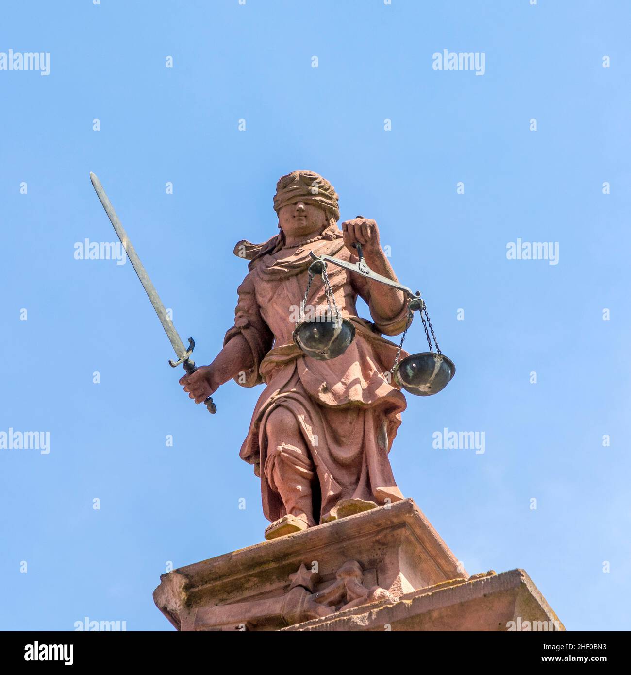 Lady justice in Worms under clear blue sky Stock Photo - Alamy