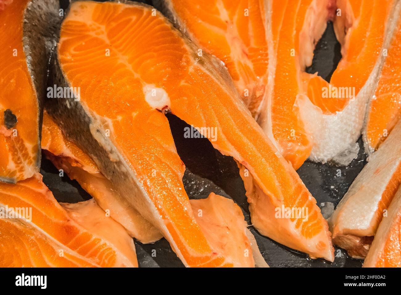 Raw salmon steak fish fresh seafood on supermarket counter background ...