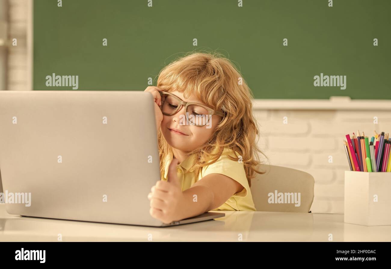 child studying on computer. teen boy in classroom. back to school ...
