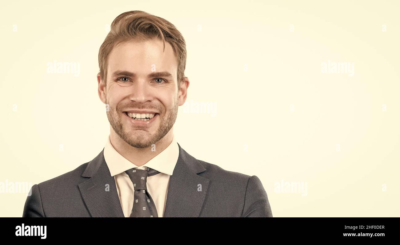Portrait of happy guy smiling in formal suit isolated on white copy ...