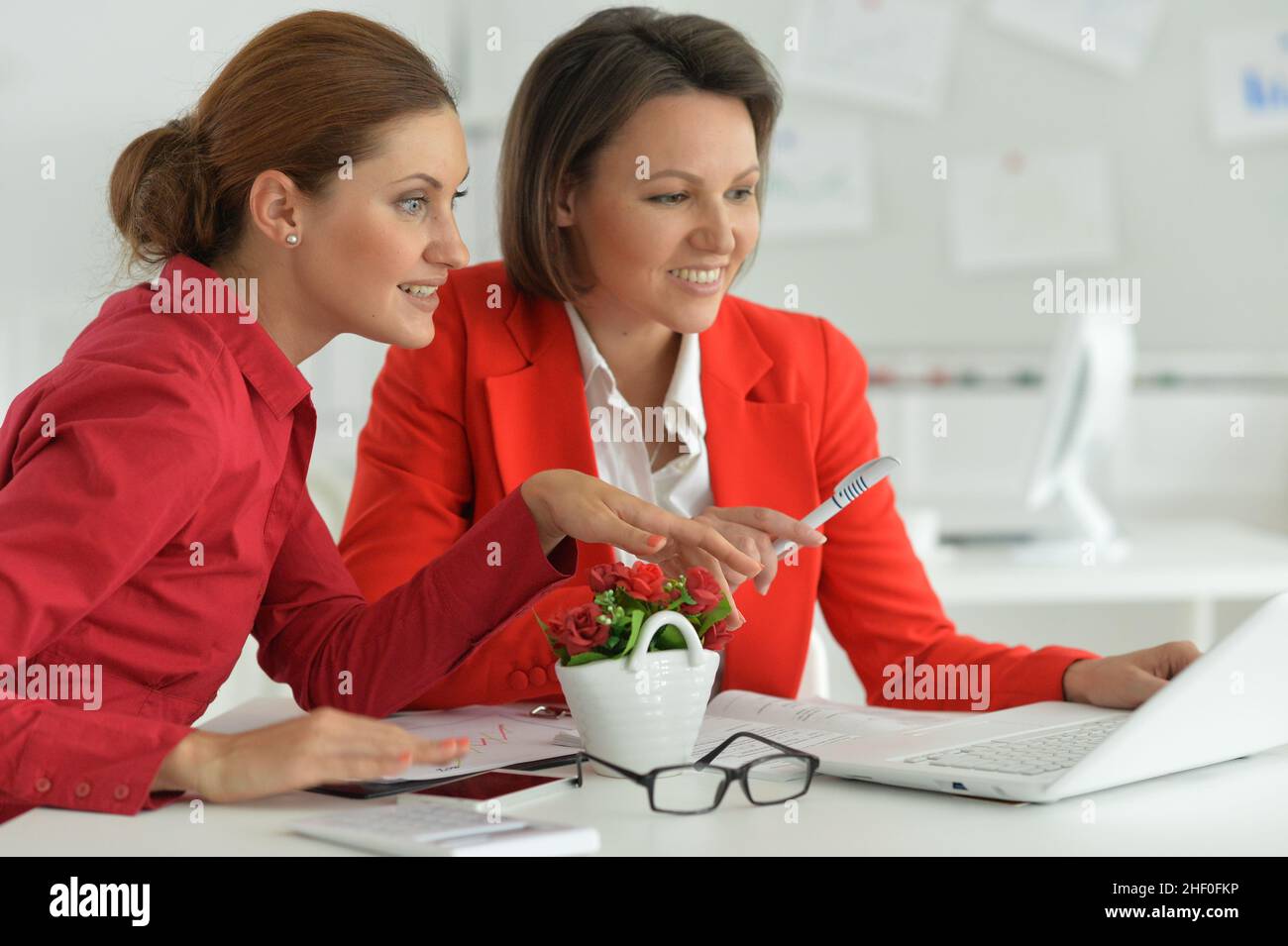 Business women architects working in modern office with laptop Stock ...