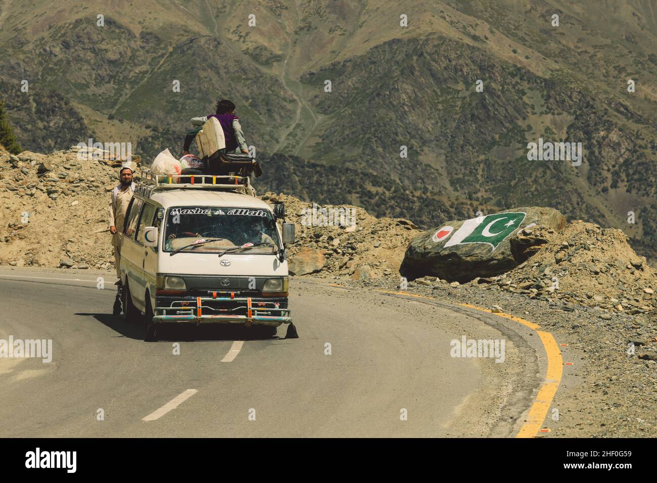 Gilgit, Pakistan - June 10, 2018: Old Cars with Pakistani People moving ...