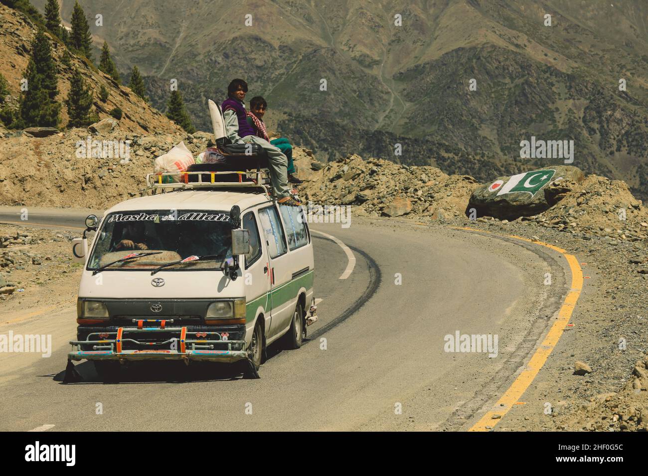 Gilgit, Pakistan - June 10, 2018: Old Cars with Pakistani People moving ...