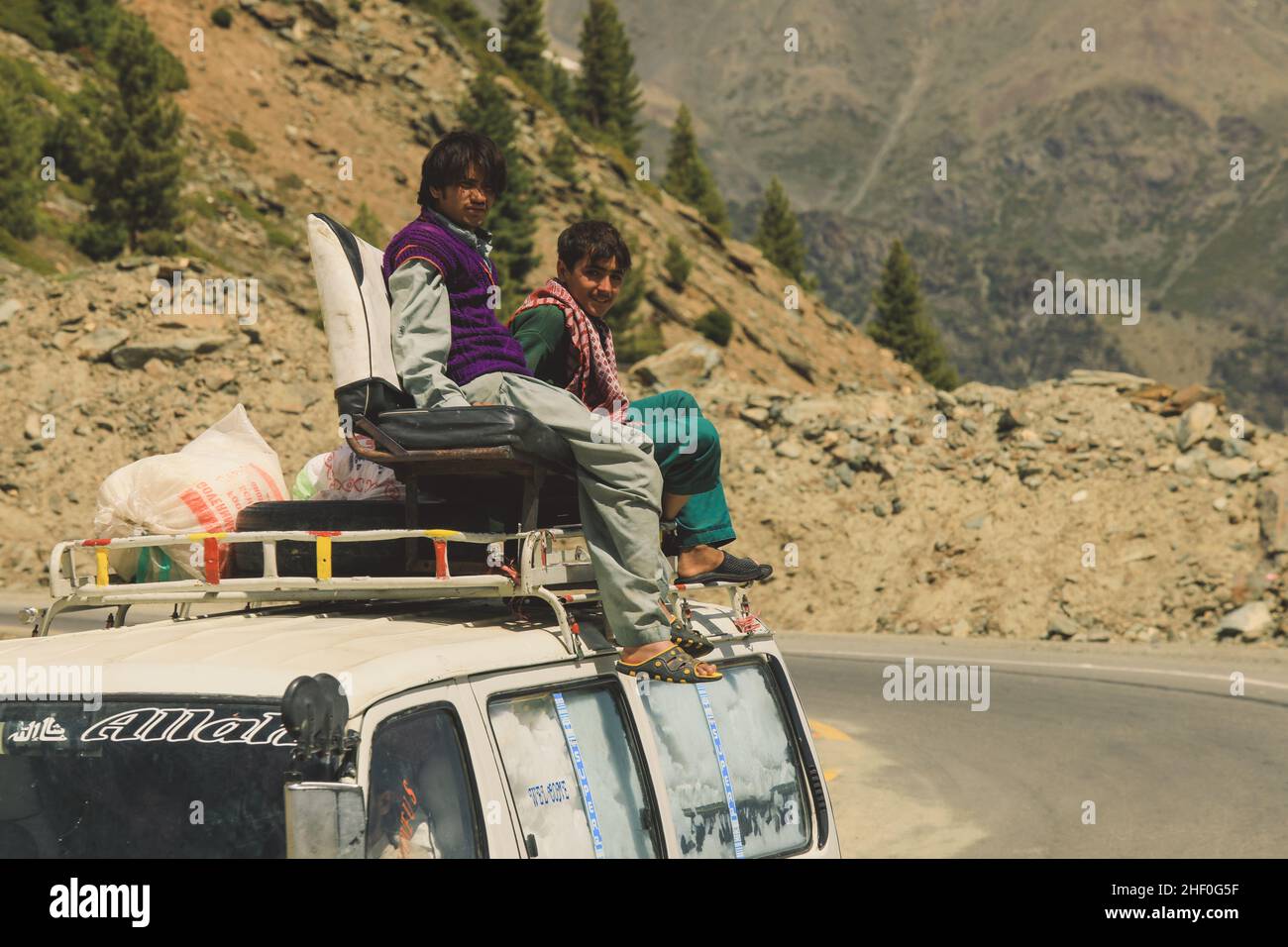 Gilgit, Pakistan - June 10, 2018: Old Cars with Pakistani People moving ...