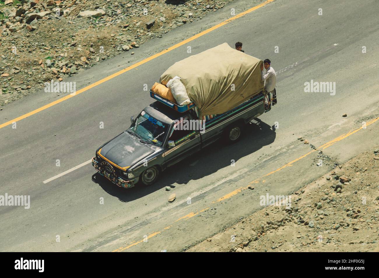 Gilgit, Pakistan - June 10, 2018: Old Cars with Pakistani People moving ...