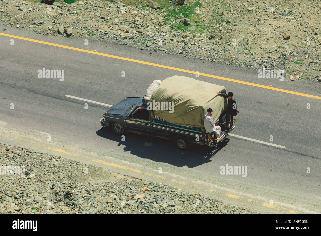 Gilgit, Pakistan - June 10, 2018: Old Cars with Pakistani People moving ...