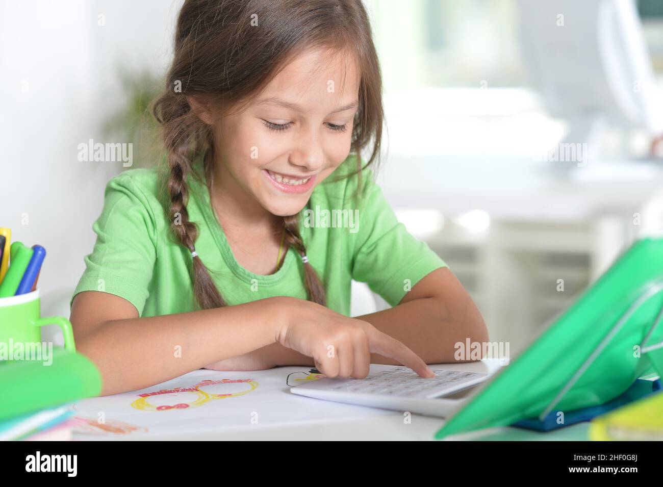 Cute teen girl doing homework in her room Stock Photo - Alamy