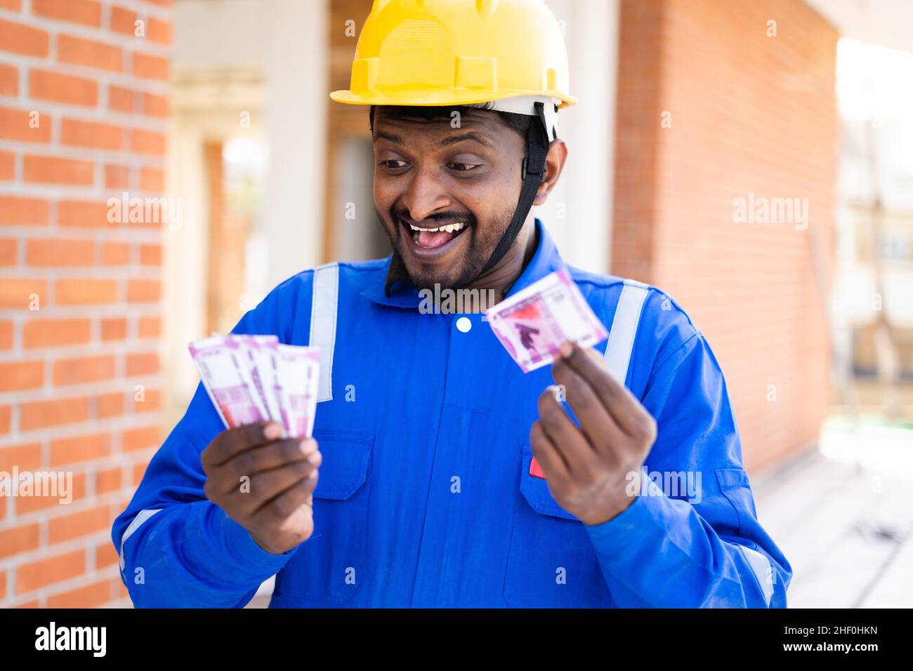 excited happy plumber after seeing or counting Money - concept of ...