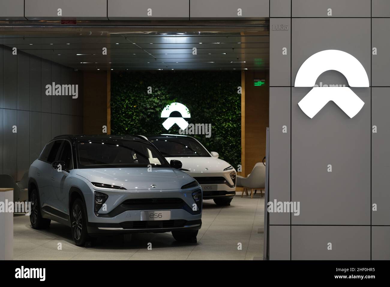 NIO brand logo in store with electric car inside. A Chinese electric ...
