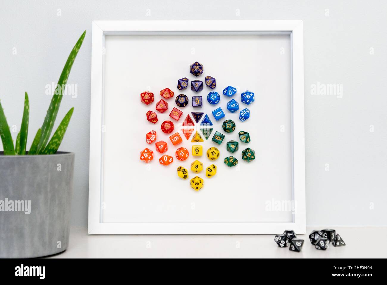 Gamer art: A framed rainbow polyhedral dice mandala Stock Photo - Alamy