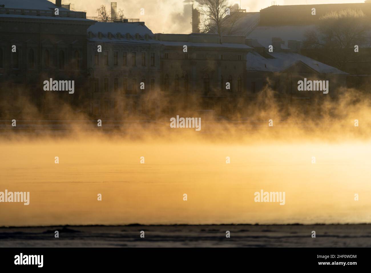 Steam comes out of river in the city, soaring from the severe cold ...