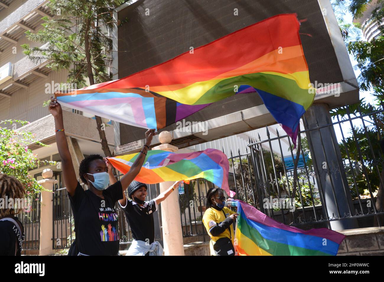Demonstrators are seen waving LGBTQ flags during a protest.The Queer ...