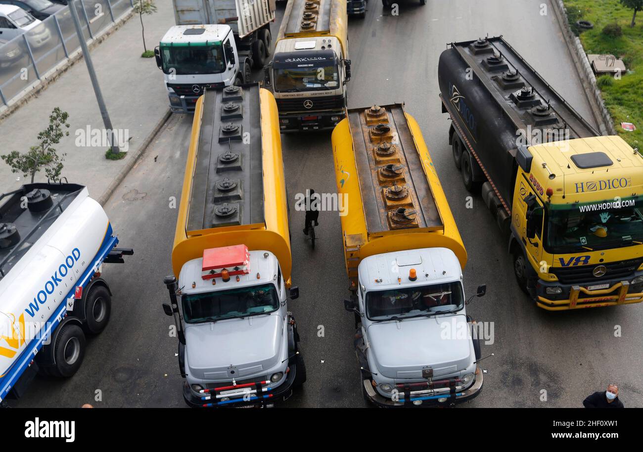 Beirut, Lebanon. 13th Jan, 2022. Drivers block a road during a protest ...