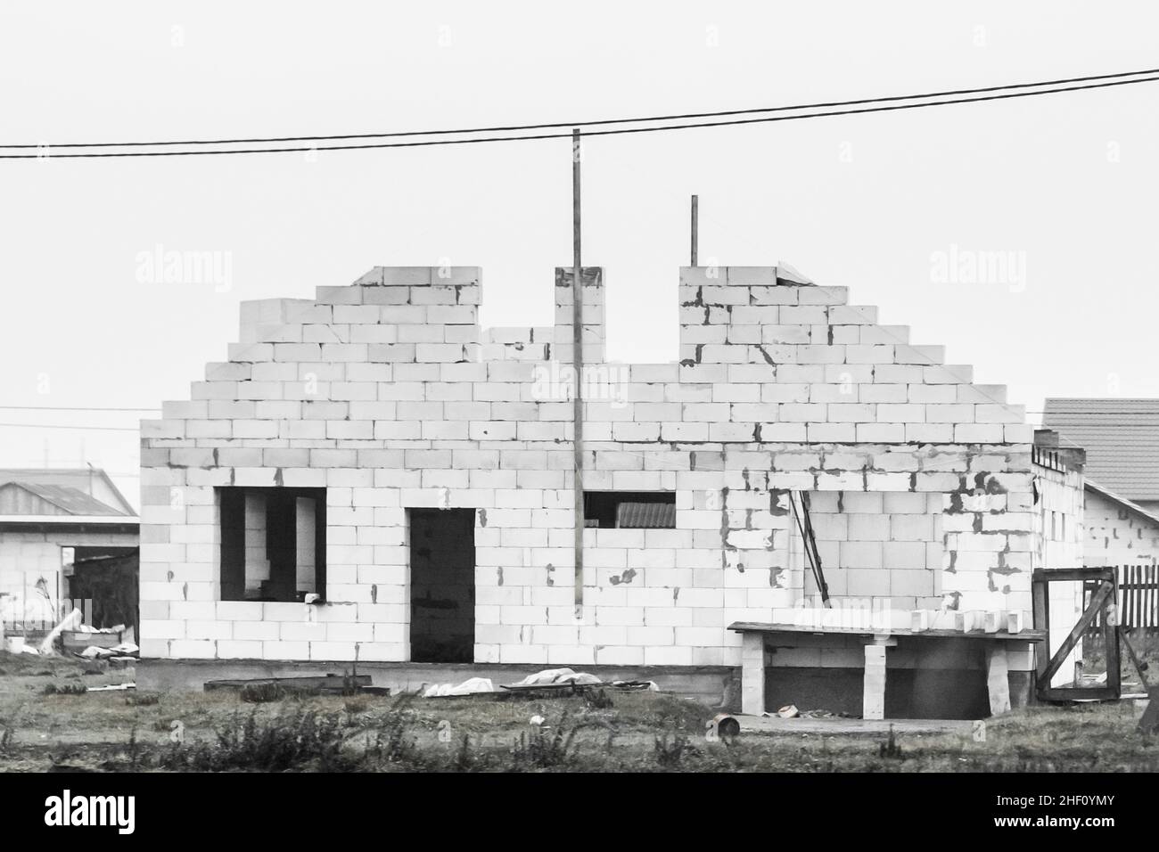 Unfinished construction in rural area. Unfinished building outdoor ...