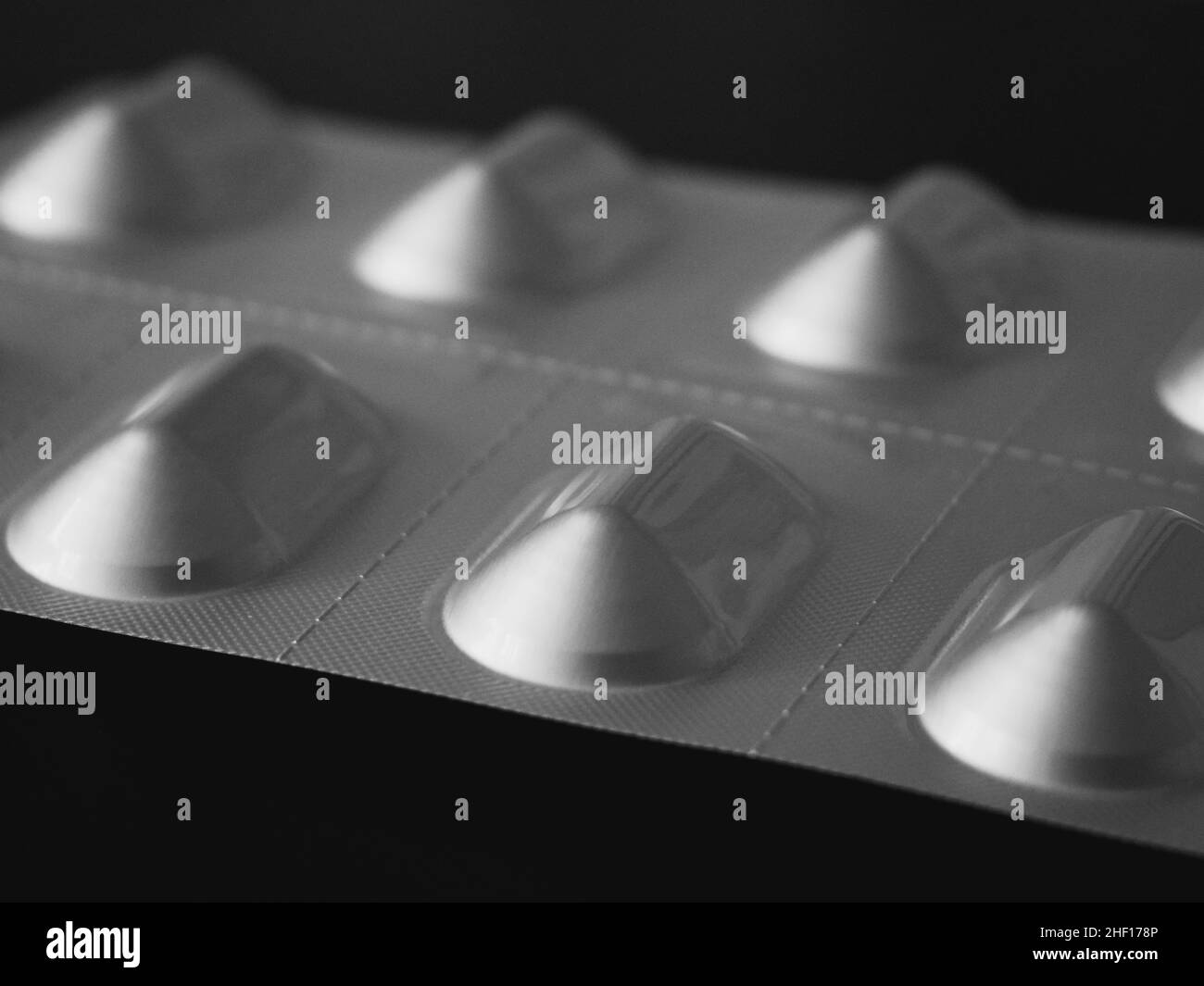 A package of pills on a black background, a close-up shot Stock Photo ...