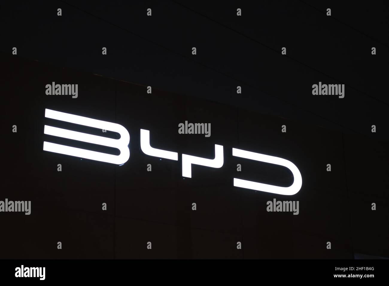 close up BYD (Build Your Dream) logo at night. EV brand of Chinese BYD ...