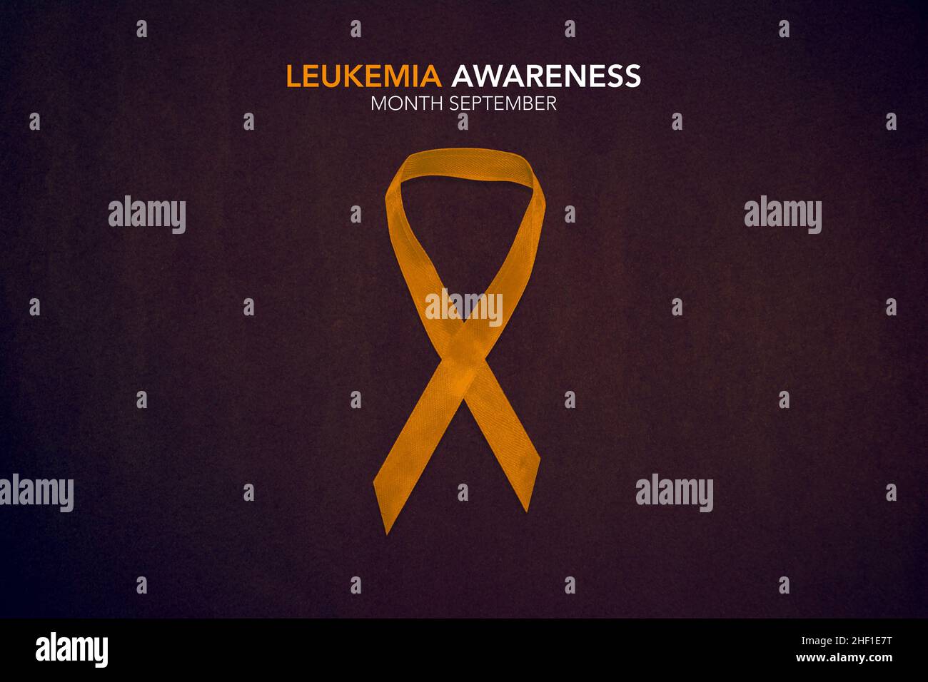 Leukemia Awareness Month. Orange Color Ribbon on brown background Stock ...