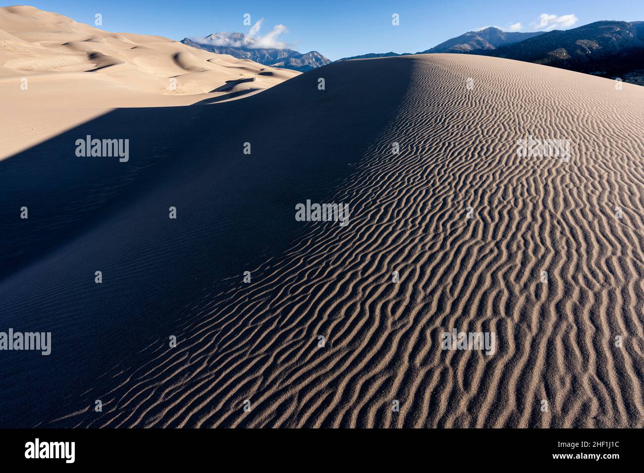 Sand dunes with ripples from wind at Great Sand Dunes National Park and ...