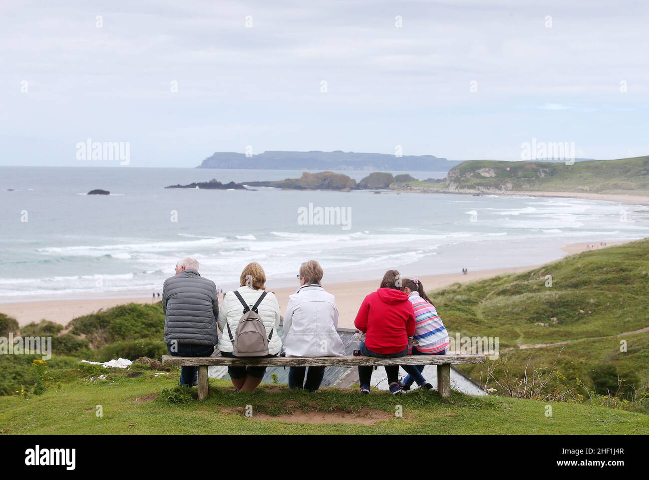 People enjoy the warm sun during summertime on the beach at Whitepark ...
