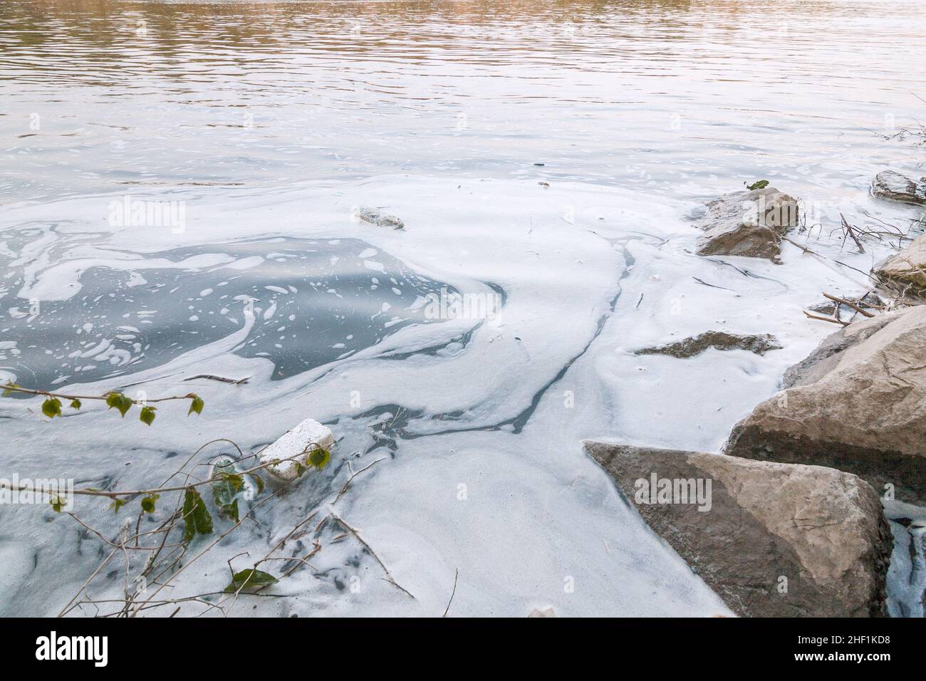 Polluted river, foam in a water near shore Stock Photo - Alamy