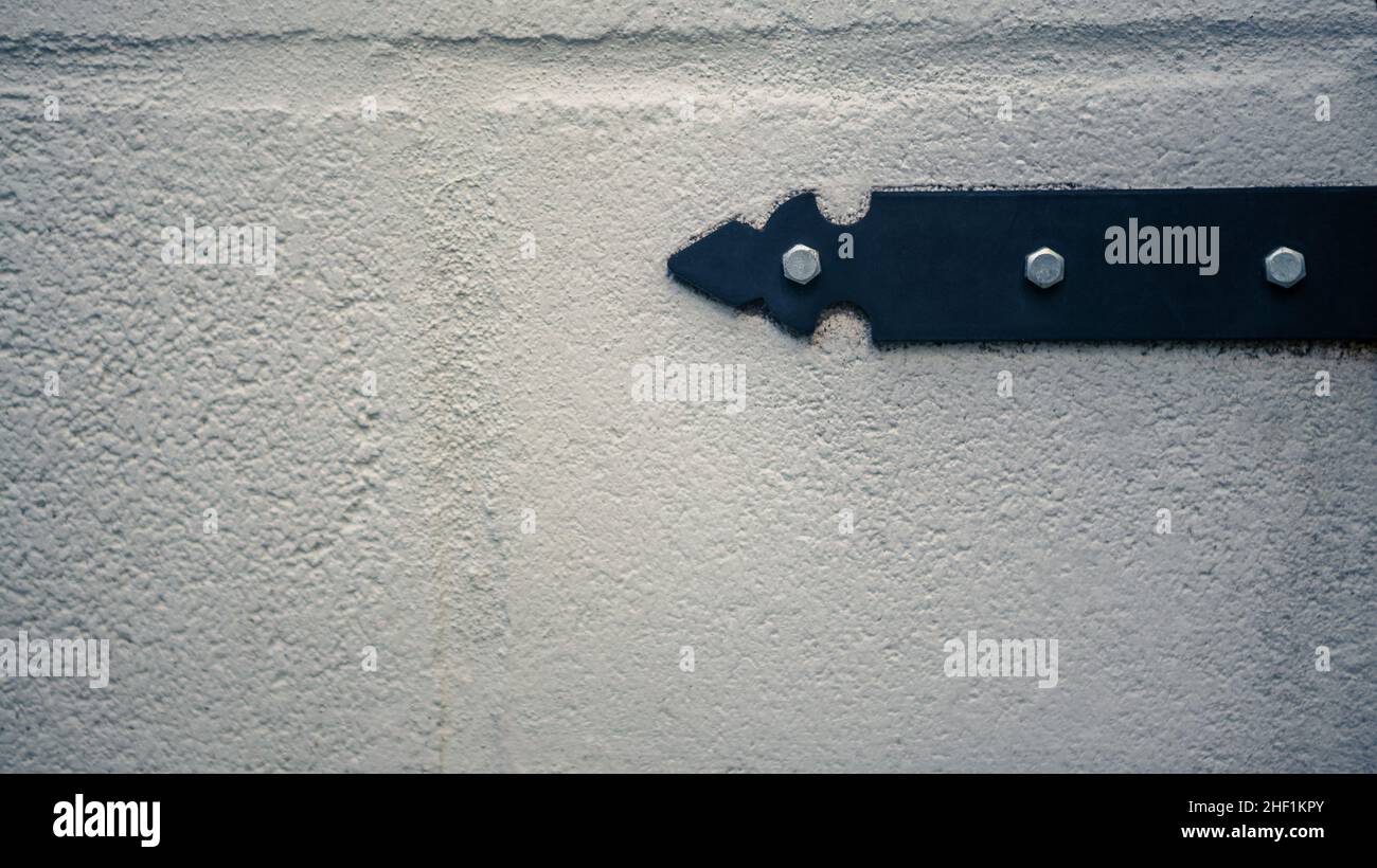 Black door hinge screwed to a concrete block wall seamless background ...