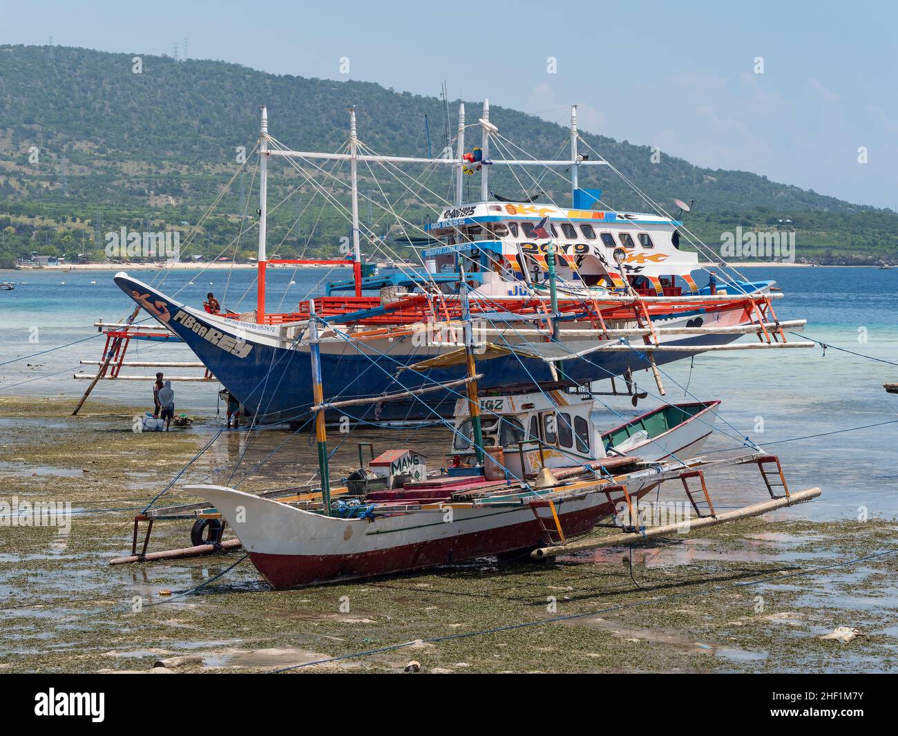 Tuna fishing boats at low tide at the village of Tinoto, Maasim in the ...