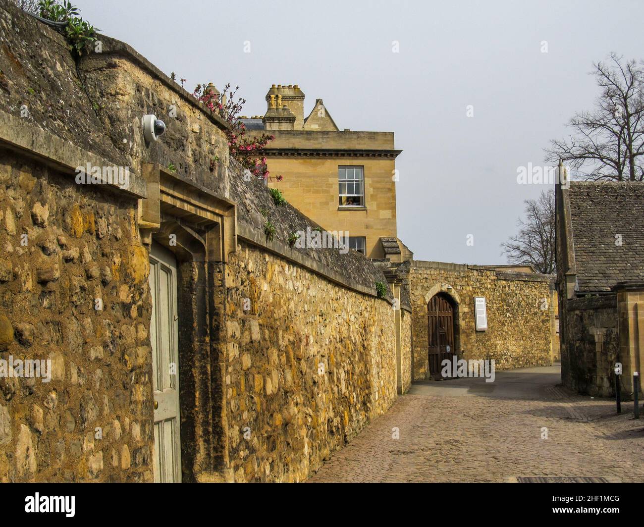Deserted road next to an old medieval wall in Oxford, England Stock ...