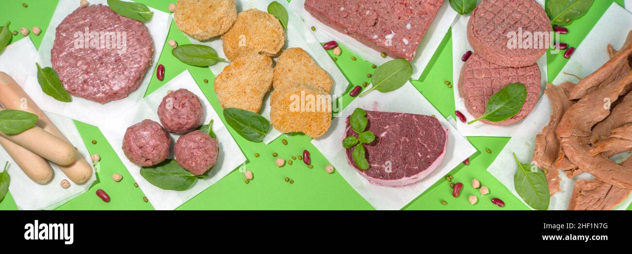 Lab-grown or plant based red meat steaks over green background Stock ...