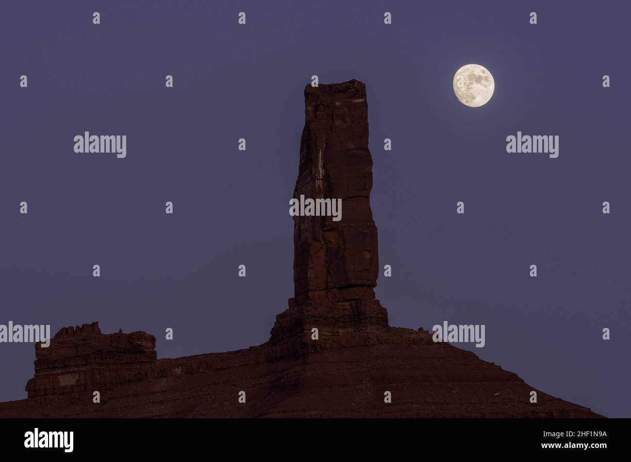 The moon rising behind Castleton Tower in Utah Stock Photo - Alamy