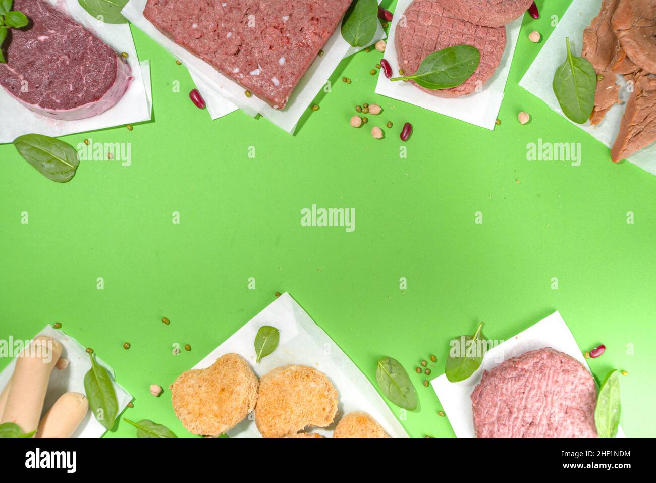 Lab-grown or plant based red meat steaks over green background Stock ...