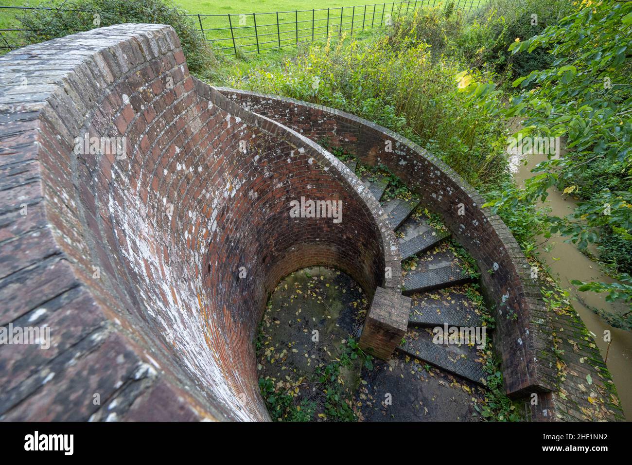 Looking down on the spiral steps leading to a culvert under the railway ...