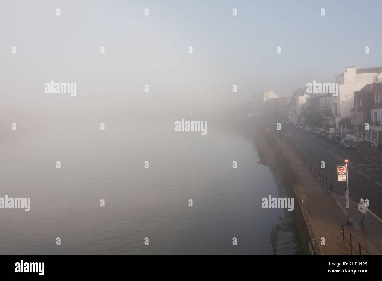 Waiting for the bus as dense fog descends on The Terrace, Barnes ...