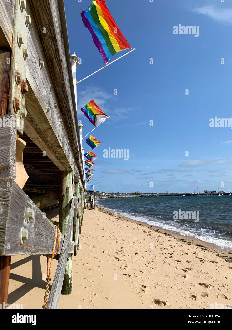 Beach and Wooden Pier with Gay Pride Flags Stock Photo - Alamy