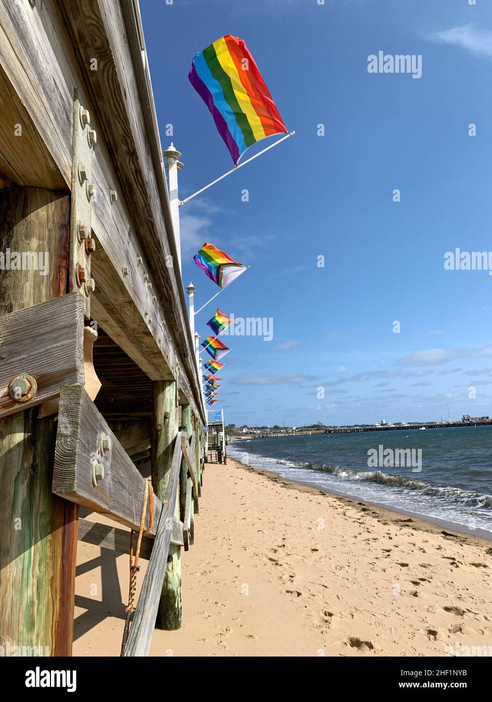 Beach and Wooden Pier with Gay Pride Flags Stock Photo - Alamy