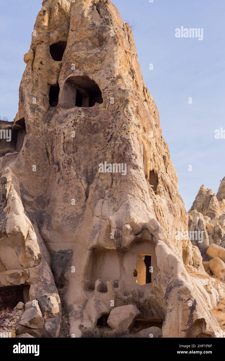 Cave houses and buildings in Cappadocia, Turkey. Stone peaks with doors ...