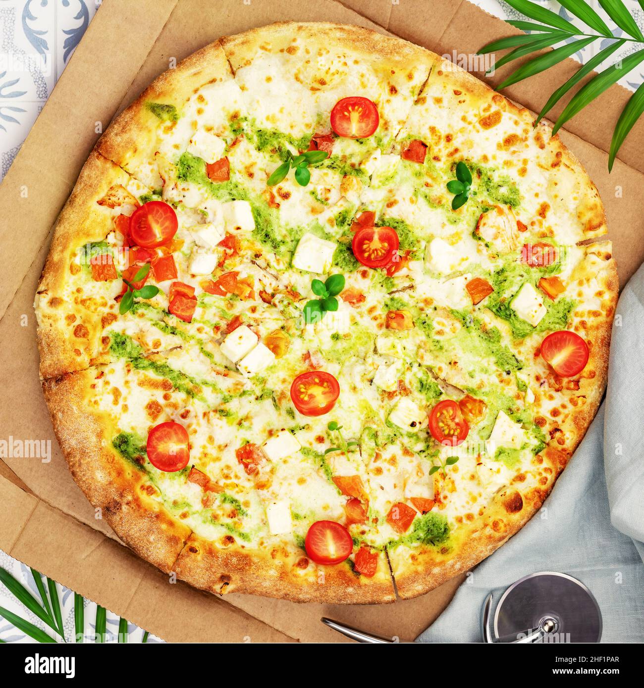 Natural italian big pesto pizza with thin dough, chicken, mozzarella ...