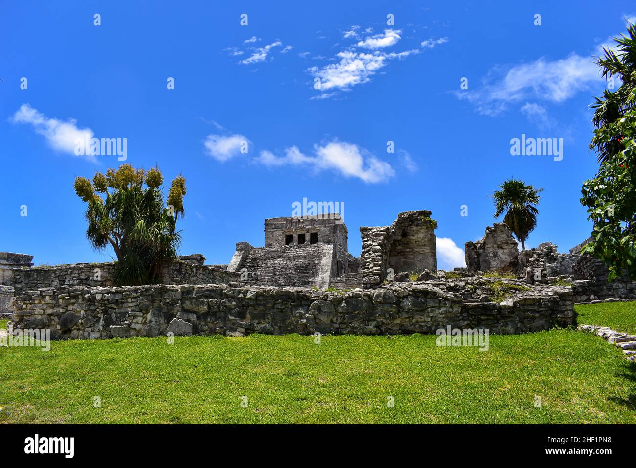 Ancient walls and ruins in the Mayan site of Tulum with a beautiful ...