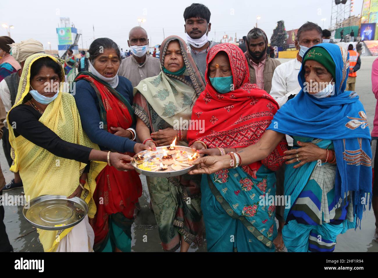 Kolkata, India. 13th Jan, 2022. Pilgrims perform rituals on a beach ...
