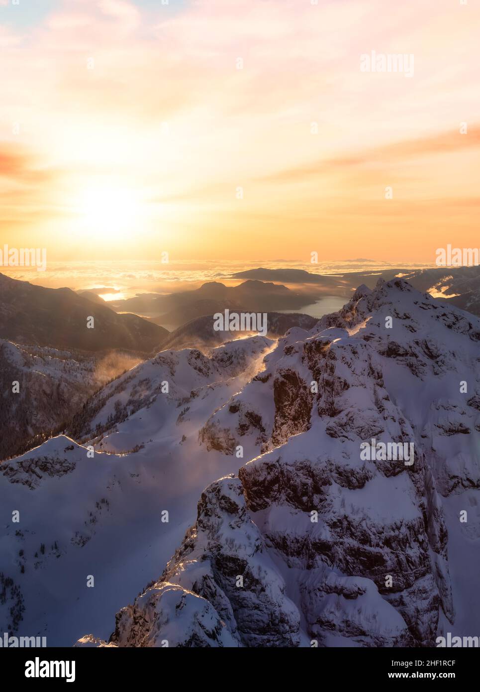 Aerial Panoramic View of Canadian Mountain covered in snow Stock Photo ...