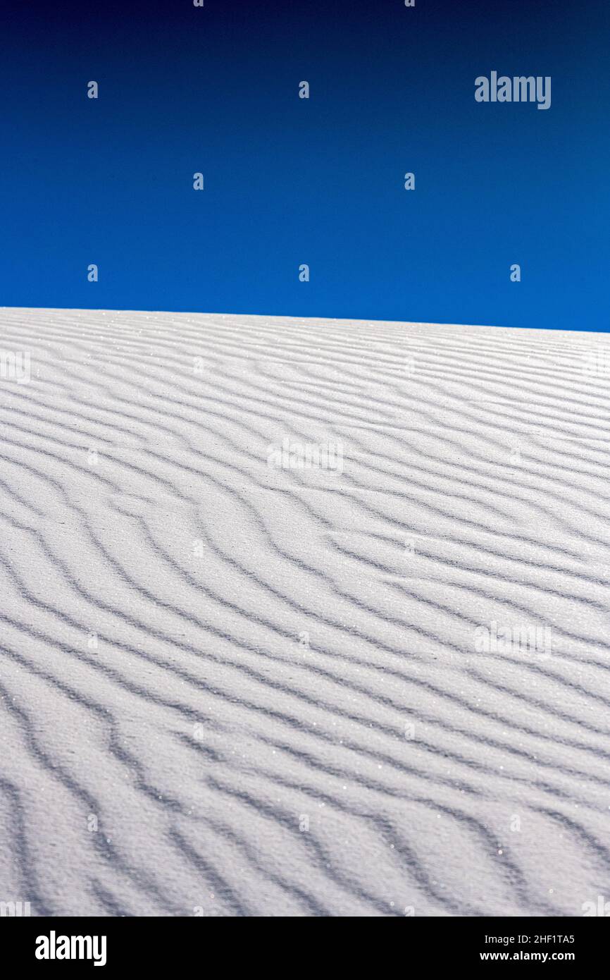 Deep Ripples In Undisturbed Sand Dune With Dark Blue Sky Above in White ...