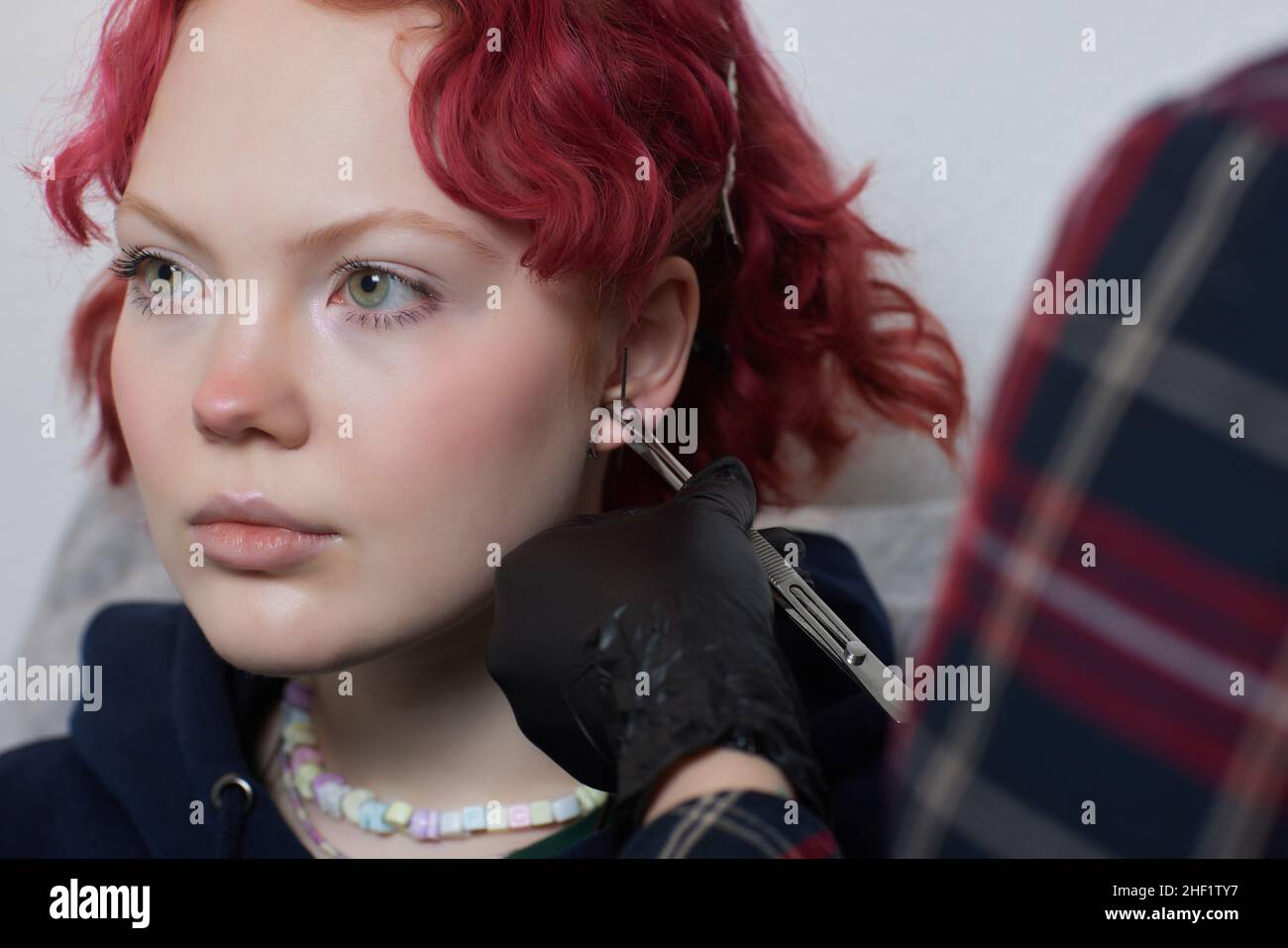 Body piercing procedure hi-res stock photography and images - Alamy