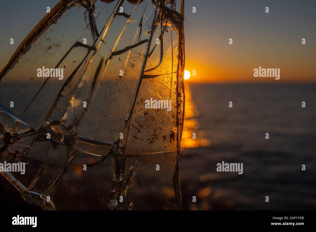 A sunset through a broken glass Stock Photo - Alamy