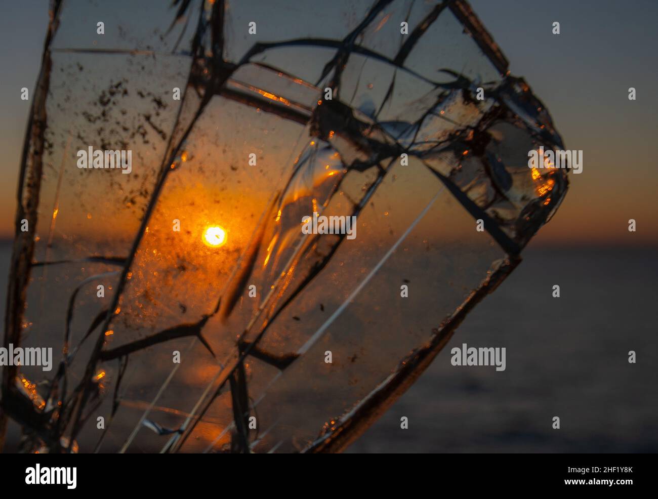 A sunset through a broken glass Stock Photo - Alamy