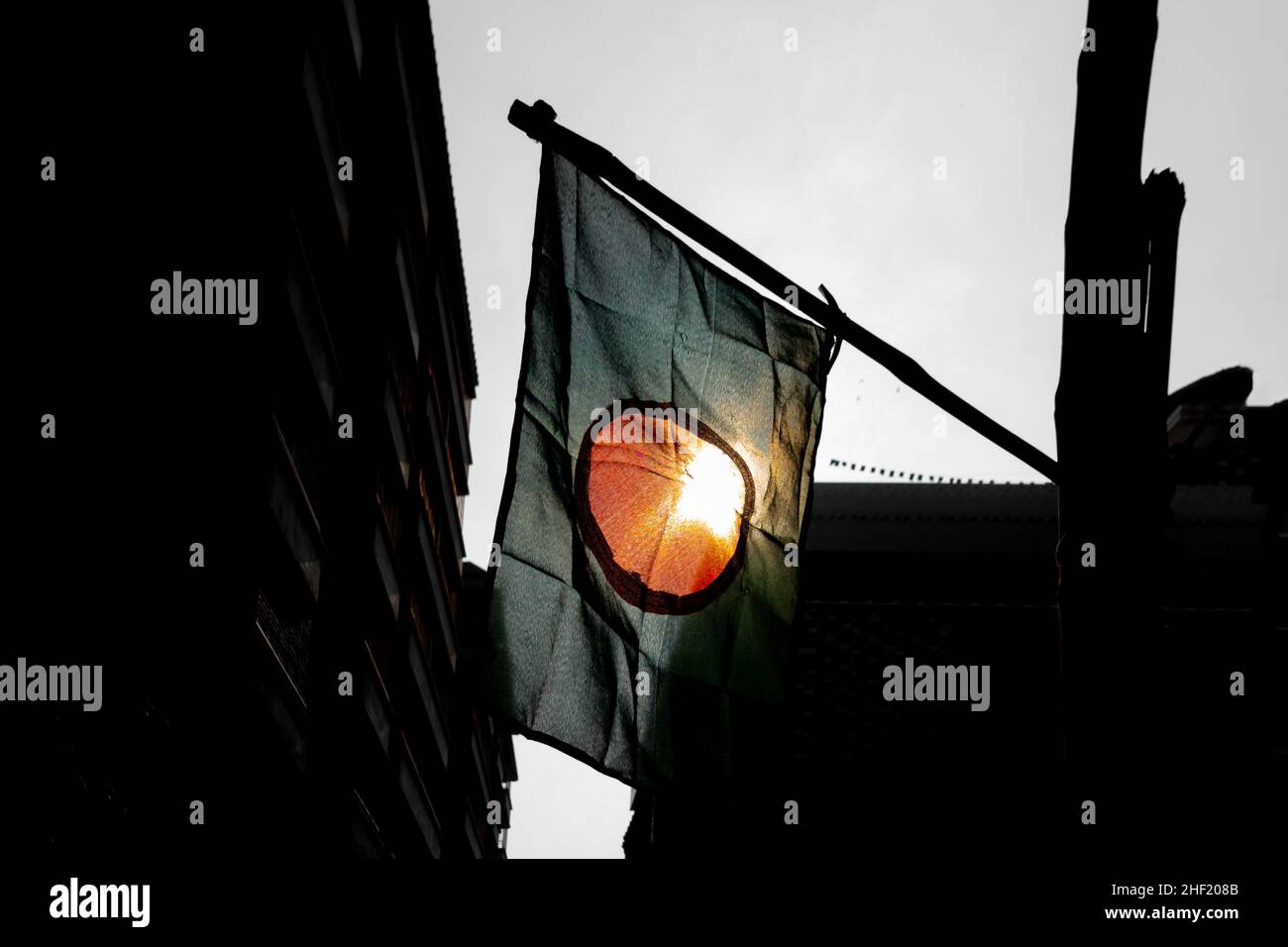 The national flag of Bangladesh is flying in the sky. The flag of ...
